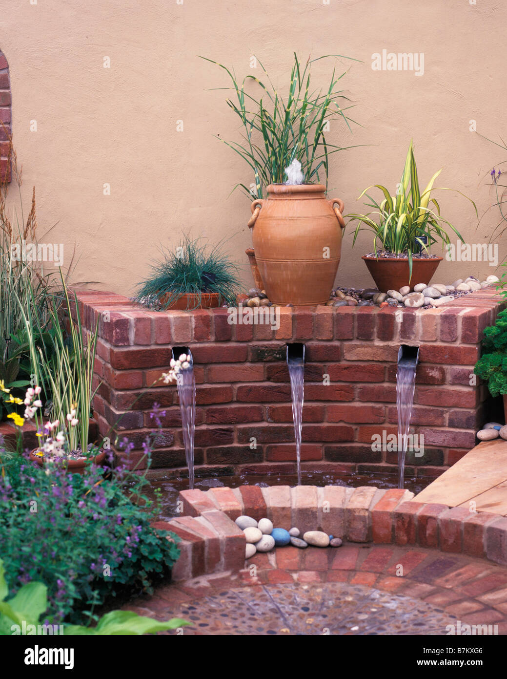 MODERN WATER FEATURE WITH WATER SPOUTS Stock Photo - Alamy