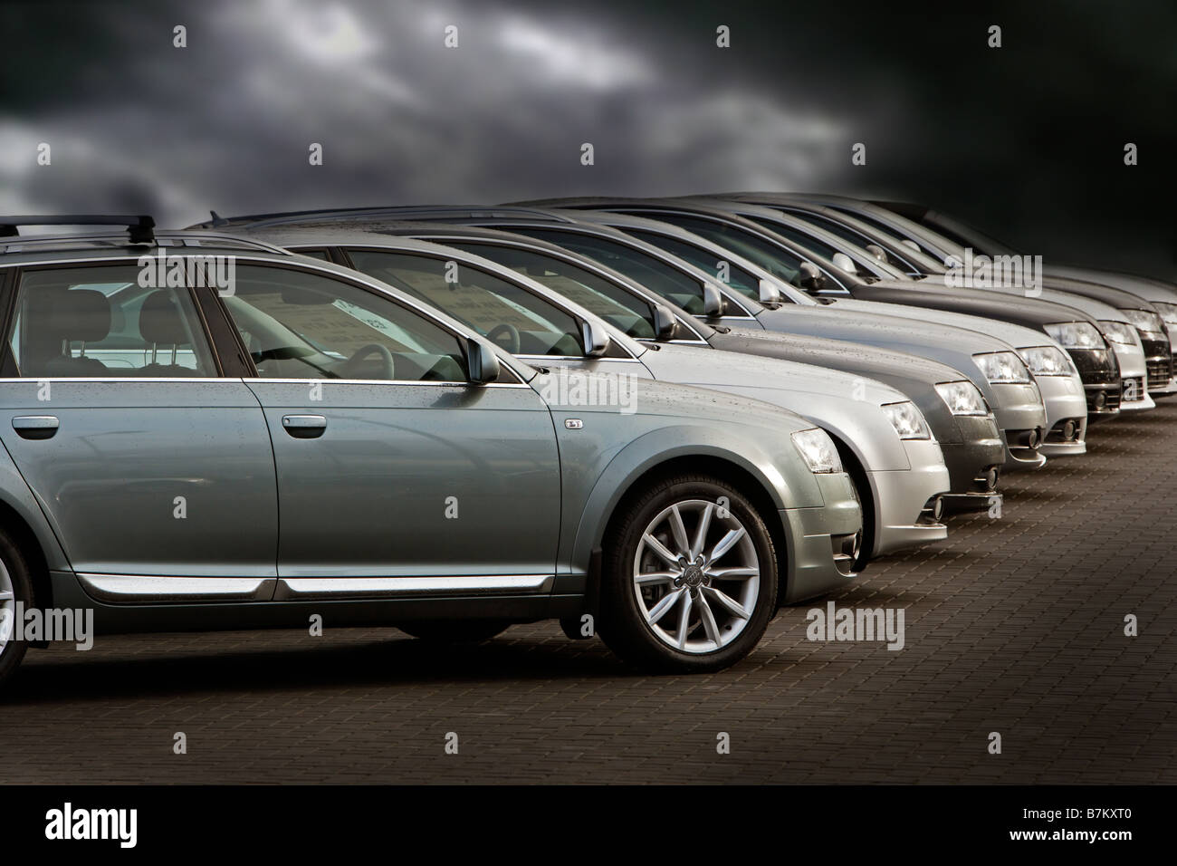 Storm Clouds over cars Stock Photo - Alamy