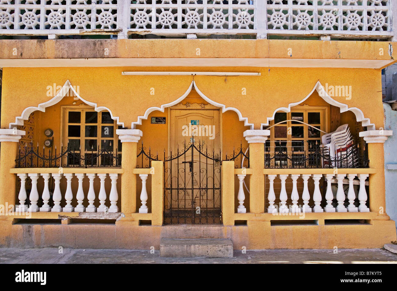 Yellow building on Isla Mujeres in Mexico with white trim and unique ...