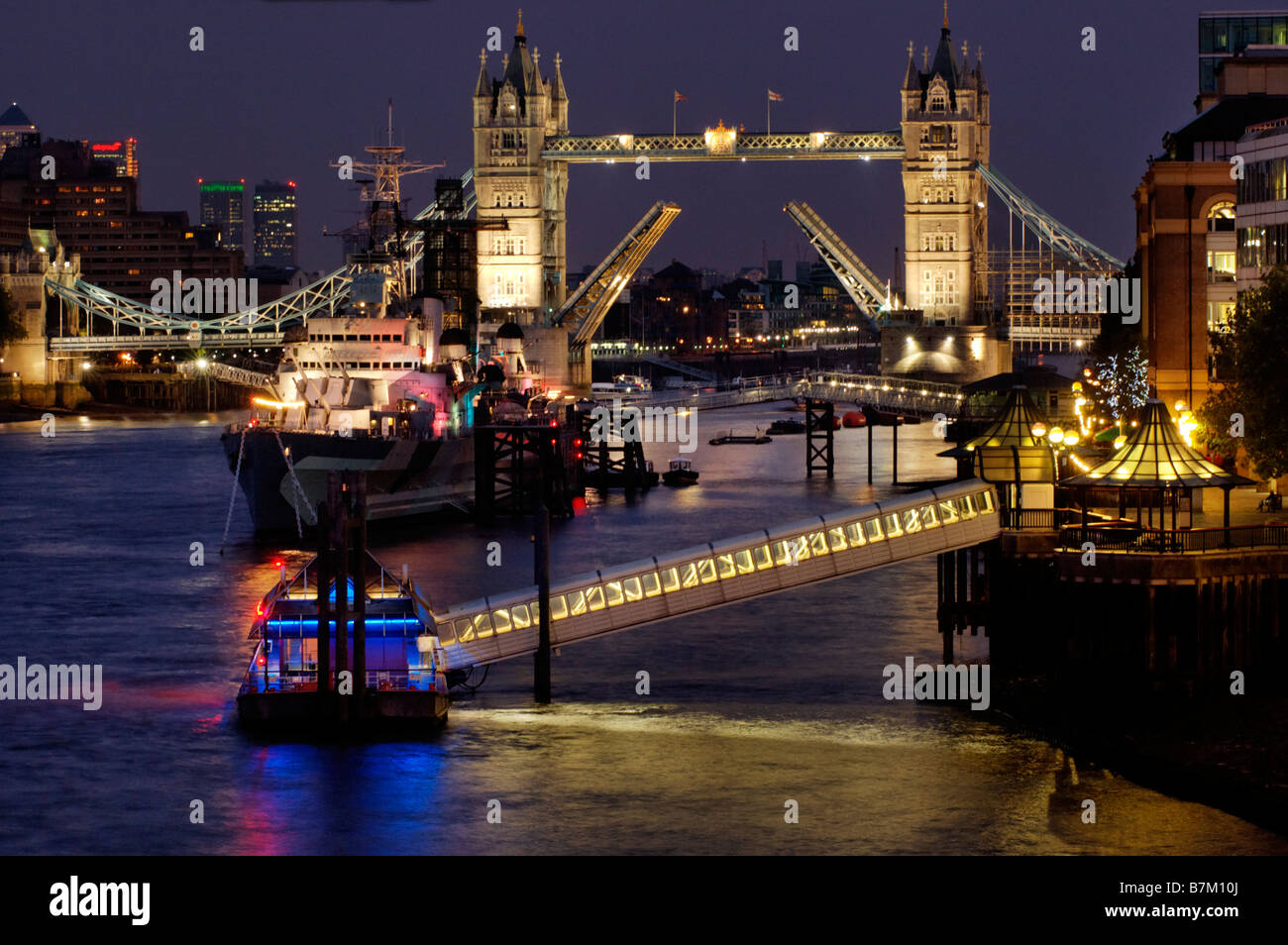 Tower Bridge at night with the bridge raised Stock Photo - Alamy