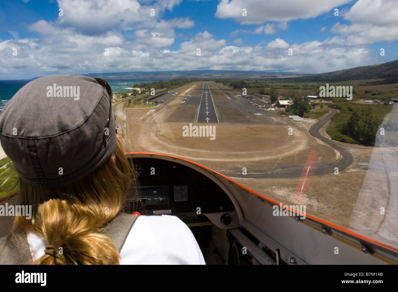 Female pilot in glider airplane approaching runway for arrival at ...