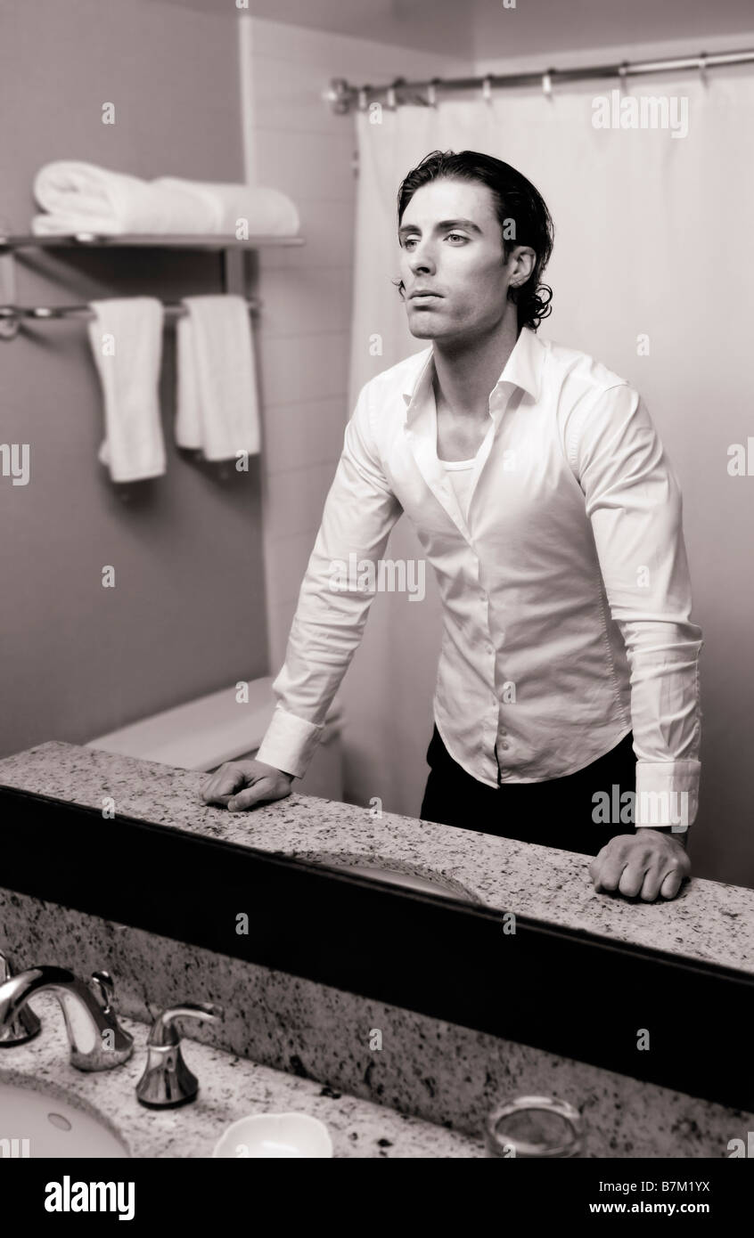 Depressed man looking mirror hi-res stock photography and images - Alamy