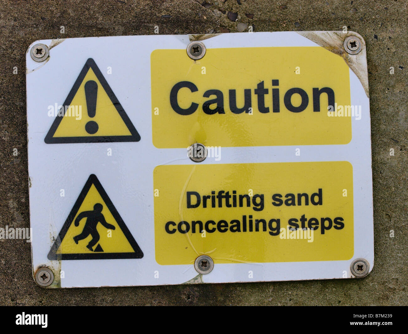 CAUTION SIGN ON SEA WALL WARNING OF DRIFTING SAND AT ECCLES NORFOLK ...