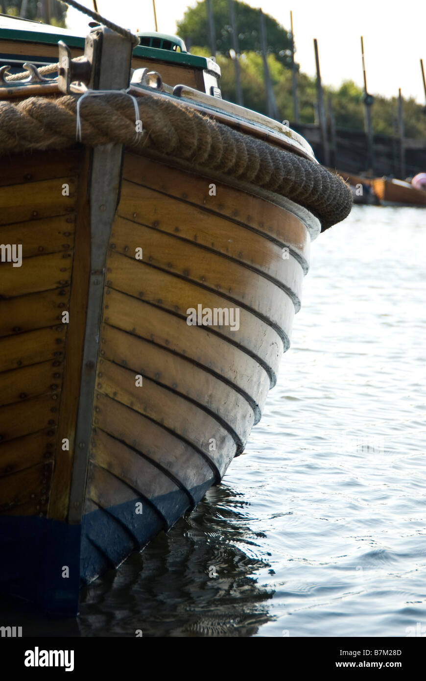A clinker built boat on the Glaven river at Blakeney, Norfolk, England ...