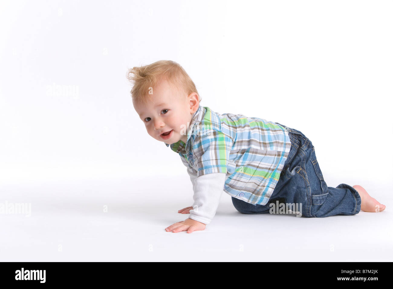 Toddlerboy crawling on the floor Stock Photo - Alamy