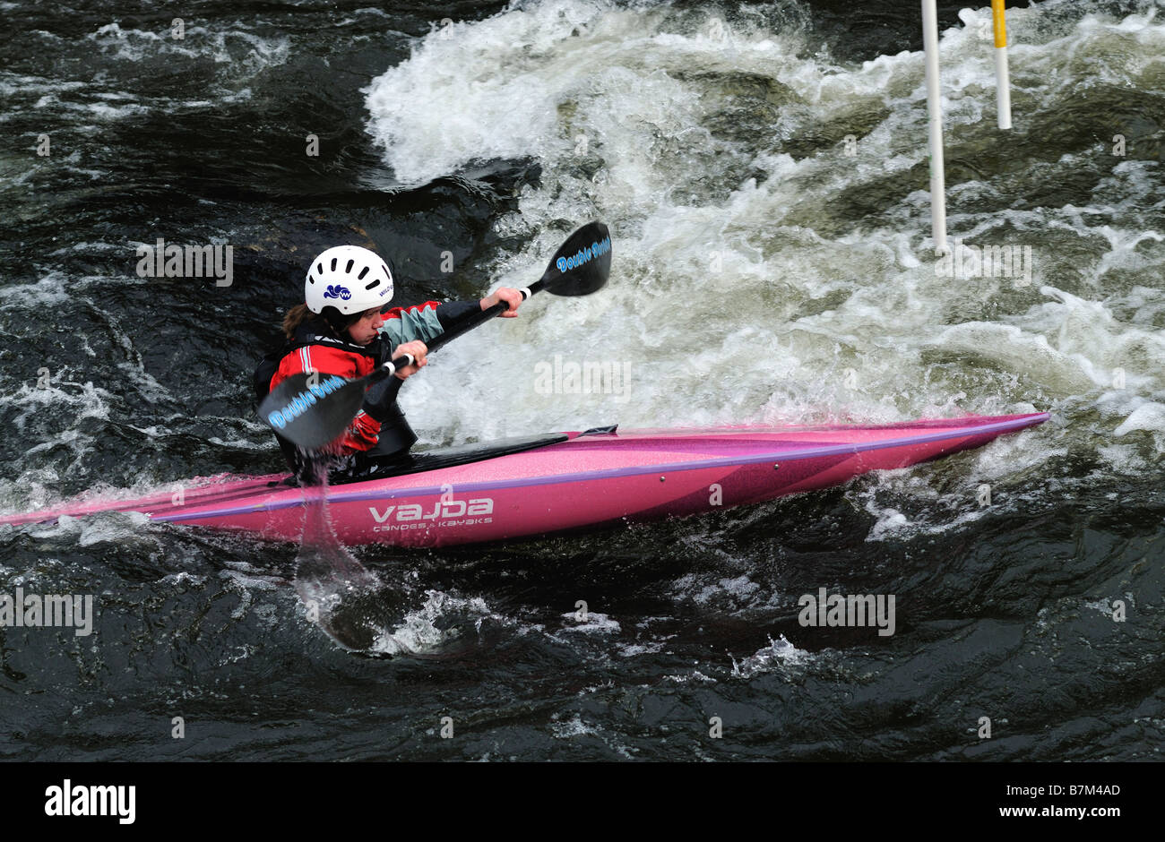 female canoeist paddling in turbulent water in river Stock Photo - Alamy