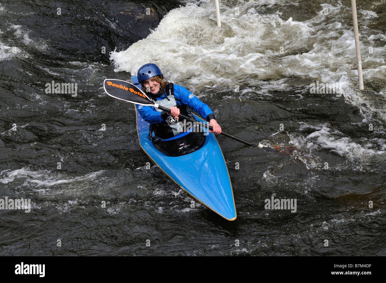 female canoeist smiling paddling in the river derwent Stock Photo - Alamy
