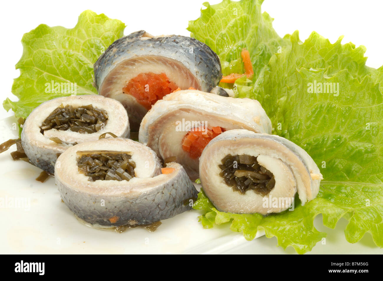 Dish from a fillet of a sea fish on a white background Stock Photo - Alamy