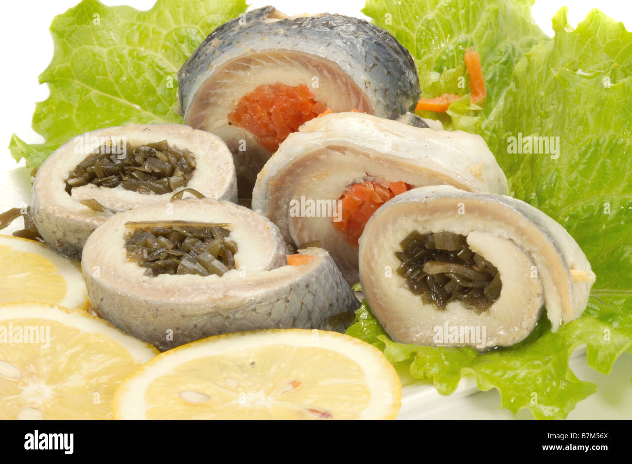 Dish from a fillet of a sea fish on a white background Stock Photo - Alamy