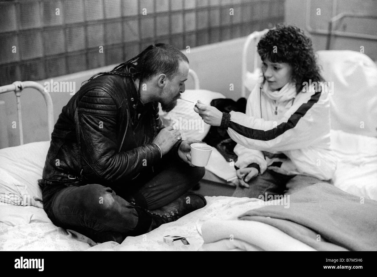 Homeless man in charity run shelter where they are given food drink and ...