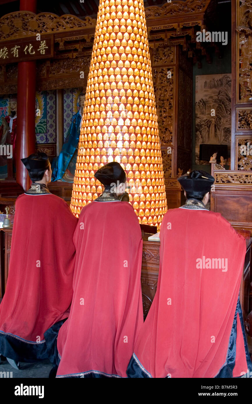 Tao monks performing a religious ceremony with chanting at Baxian Gong ...