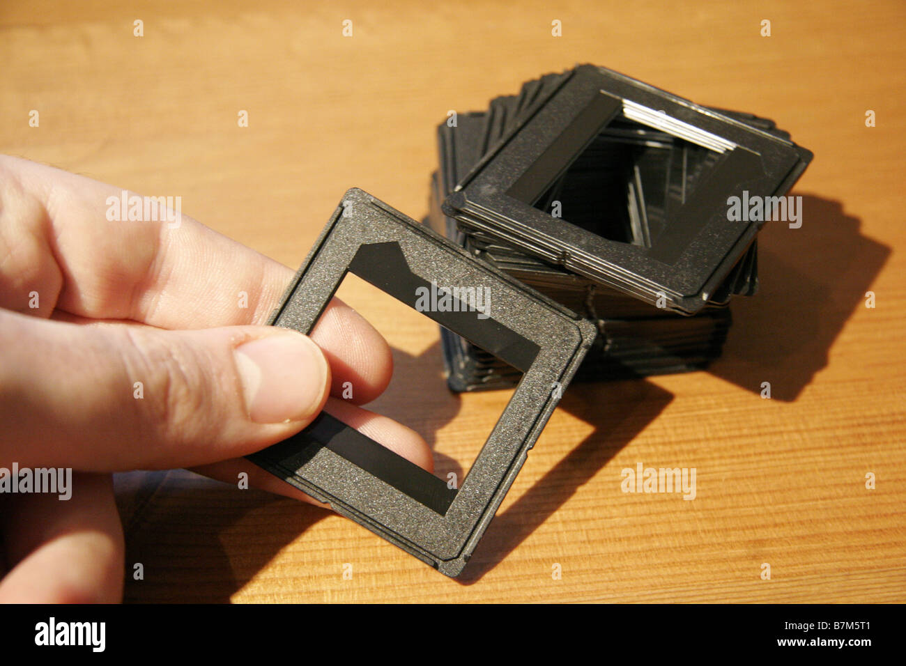 Person holding empty slide frame Stock Photo - Alamy