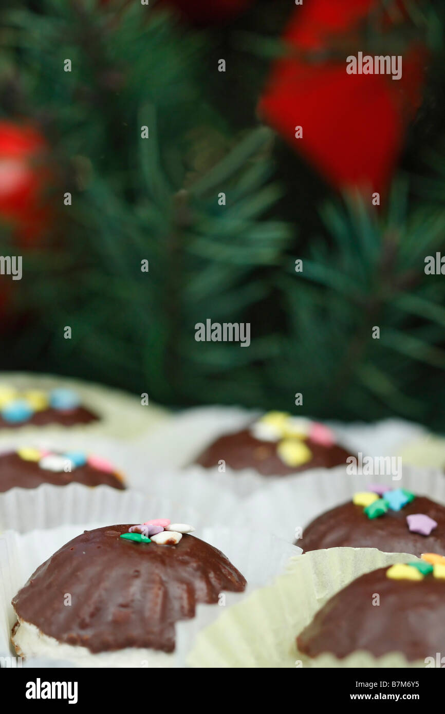 Chocolate desserts filled with walnut cream sweets cookies on a table ...