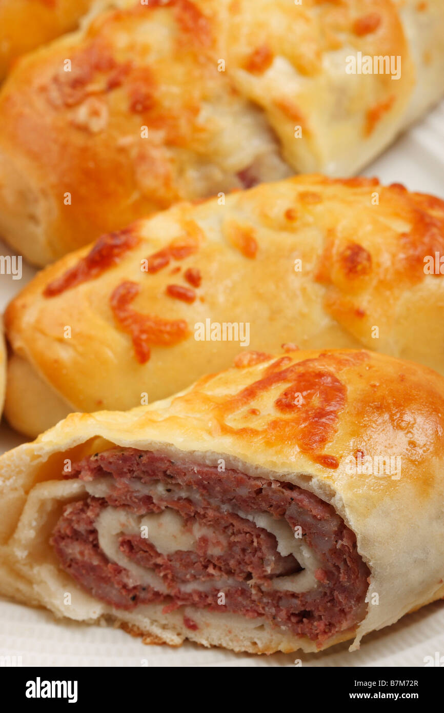 Baked salty pastry filled with minced meat on a plate overhead from ...