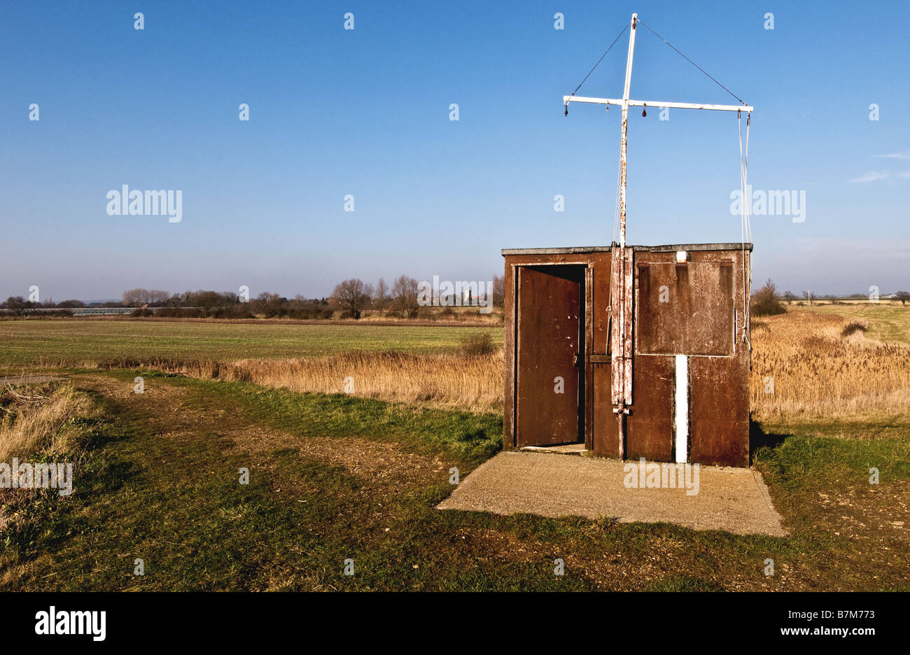 A wooden signal hut on the sea wall of the Blackwater Estuary in Essex ...