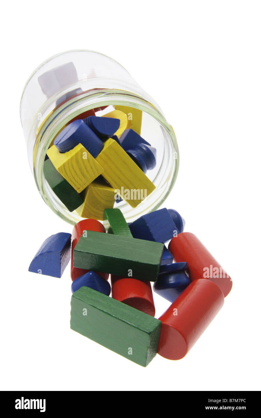 Wooden Building Blocks Spilling From Glass Jar Stock Photo - Alamy