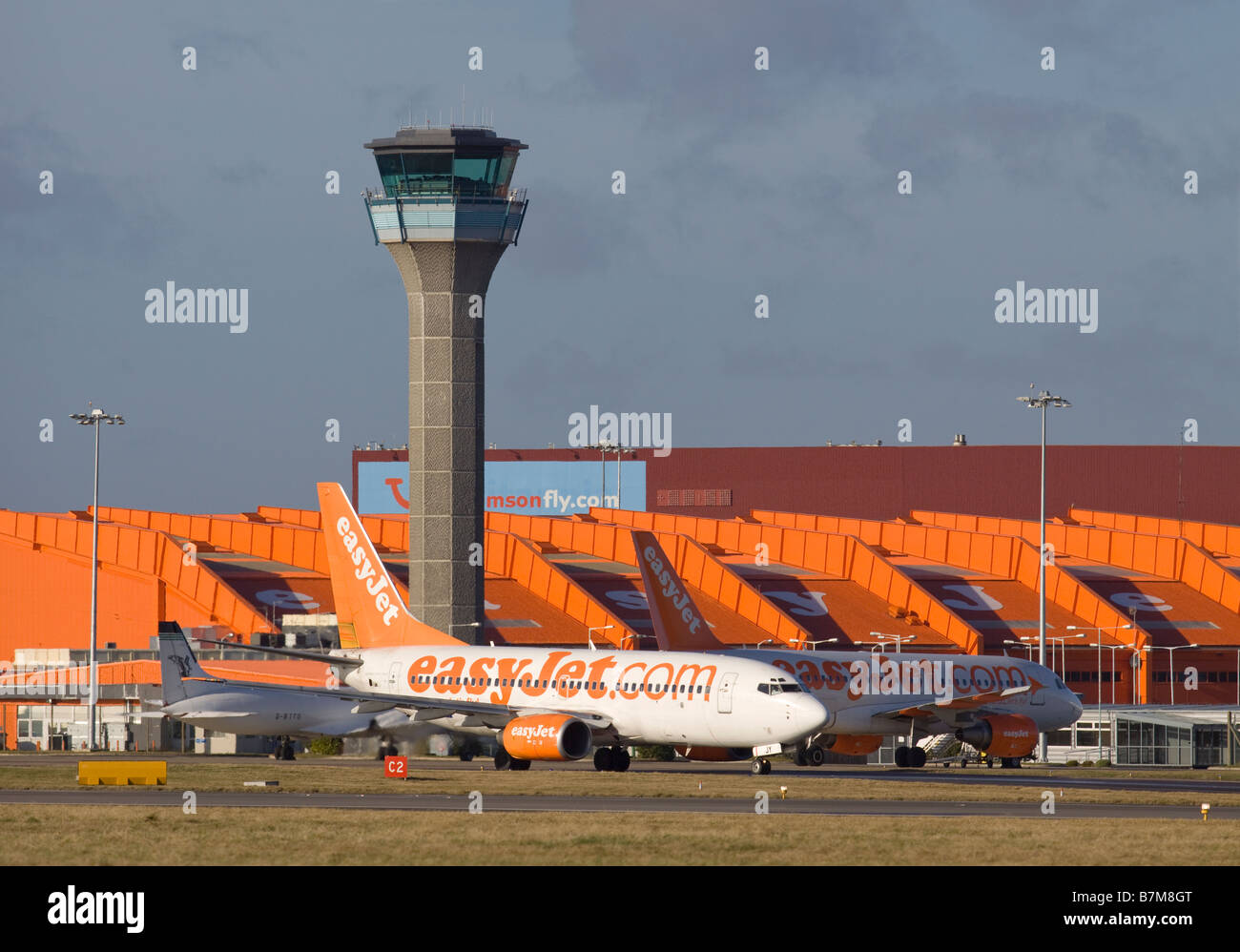EasyJet plane taxing past the control tower at London Luton airport ...
