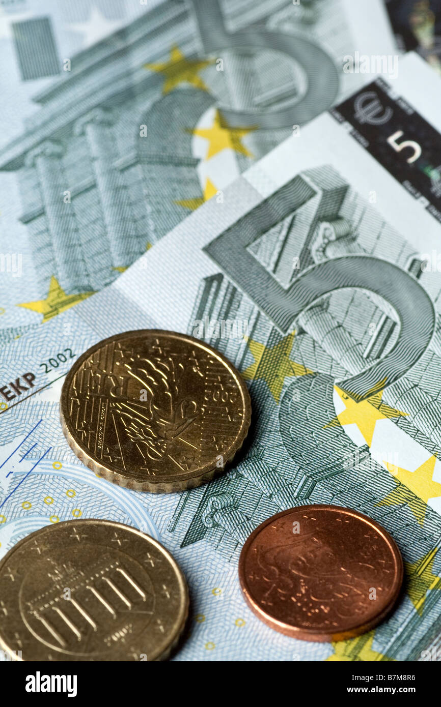 Euro notes and coins Stock Photo - Alamy