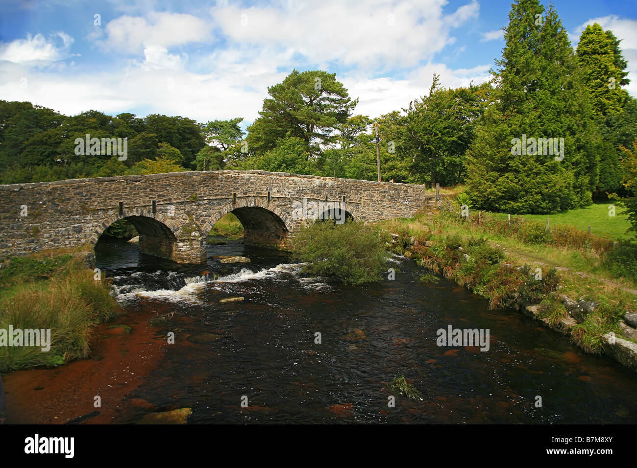 Old stone bridge across the East Dart River at Postbridge, Dartmoor ...