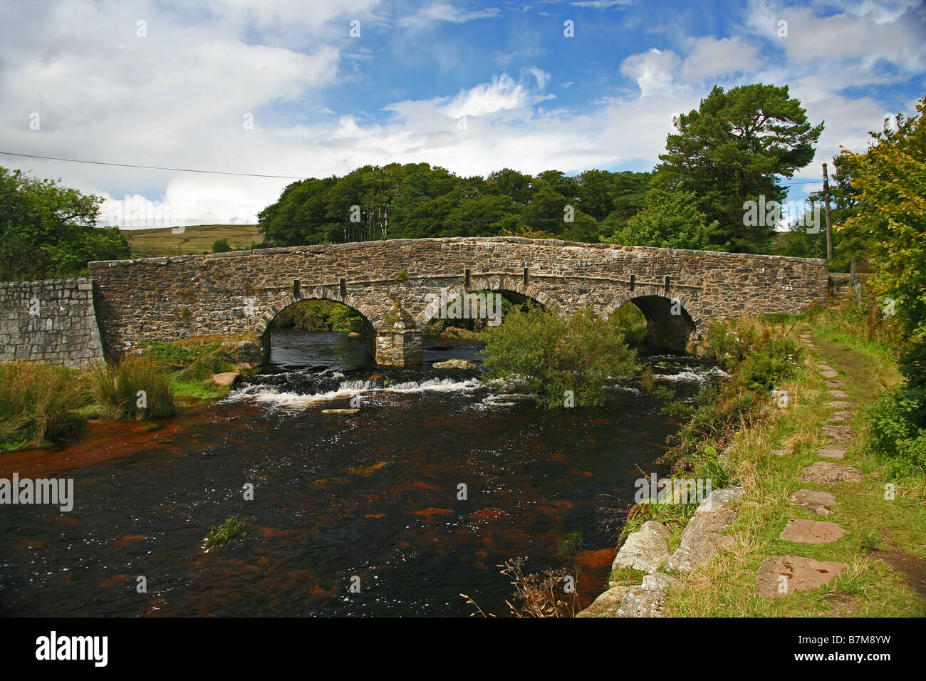Old stone bridge across the East Dart River at Postbridge, Dartmoor ...
