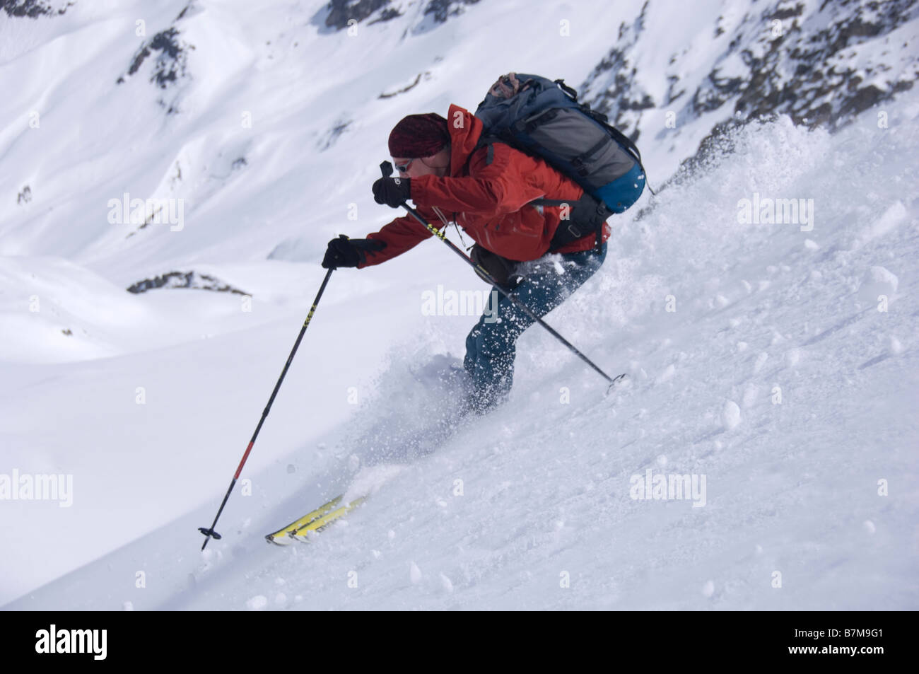 Ski alpinist descending a slope in the Swiss Alps, Graubunden Stock ...