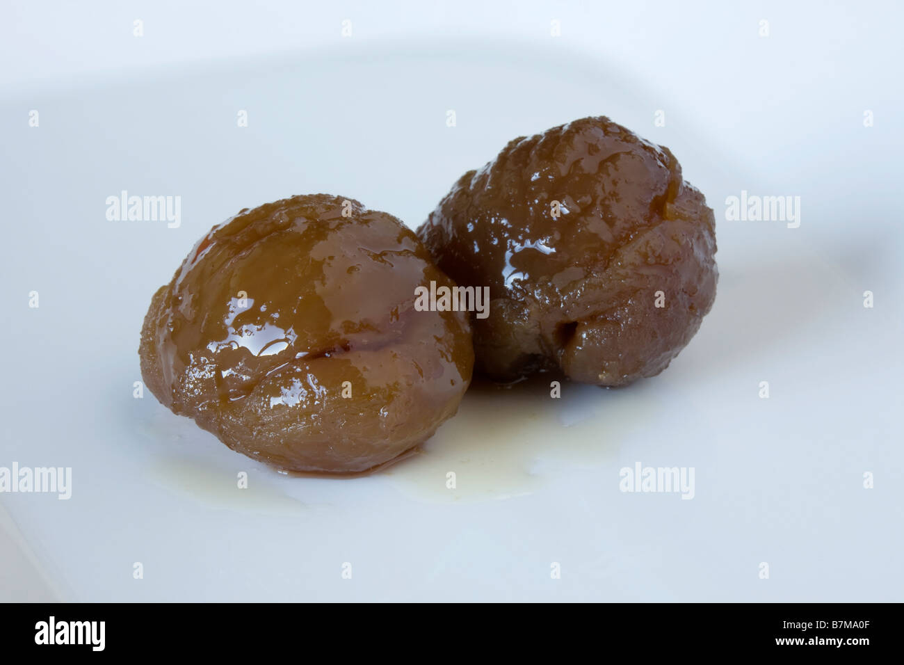 Two candied chestnuts Stock Photo - Alamy