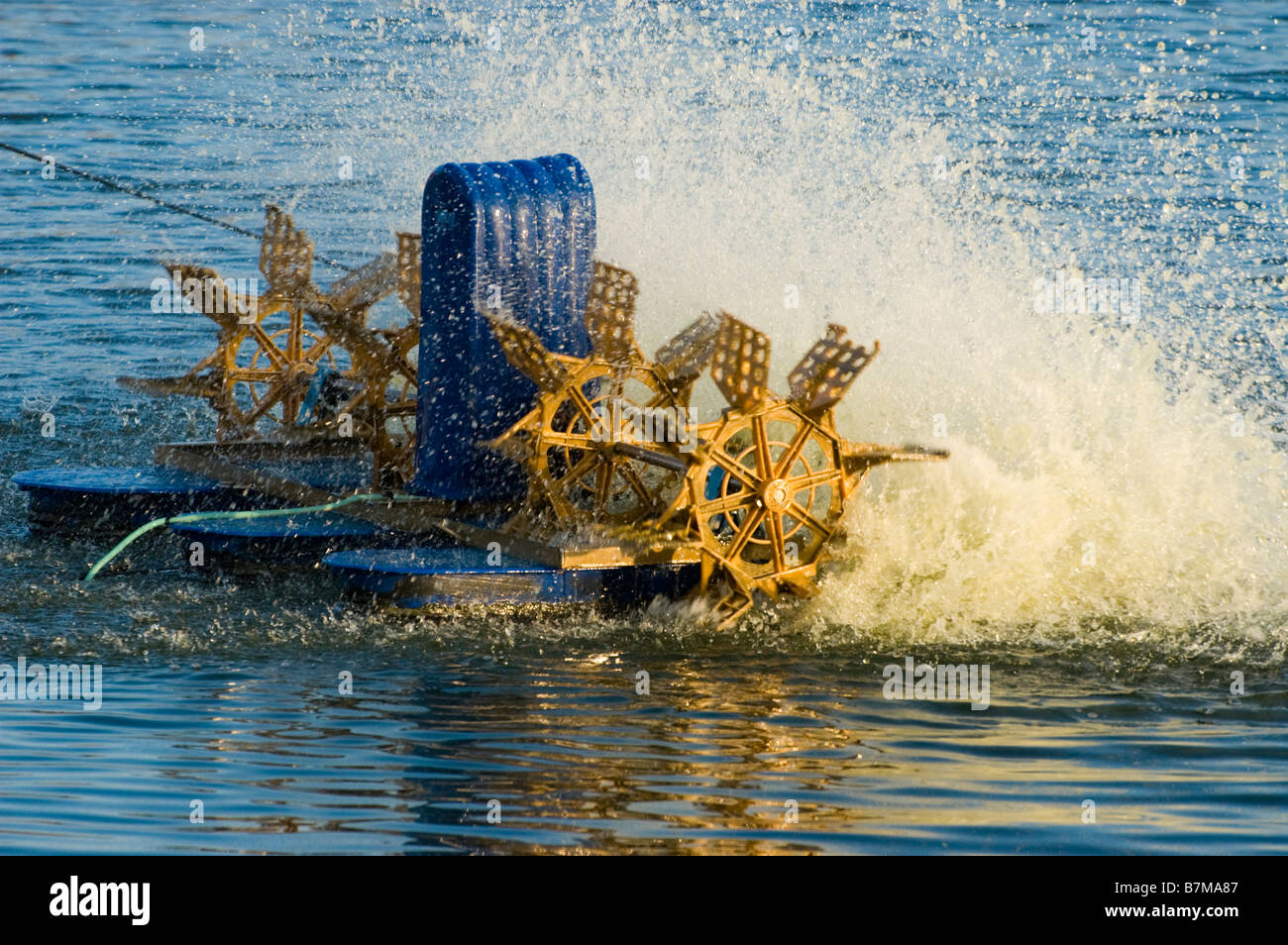 Israel Coastal Plains a fish breeding pool Agitating the water to ...