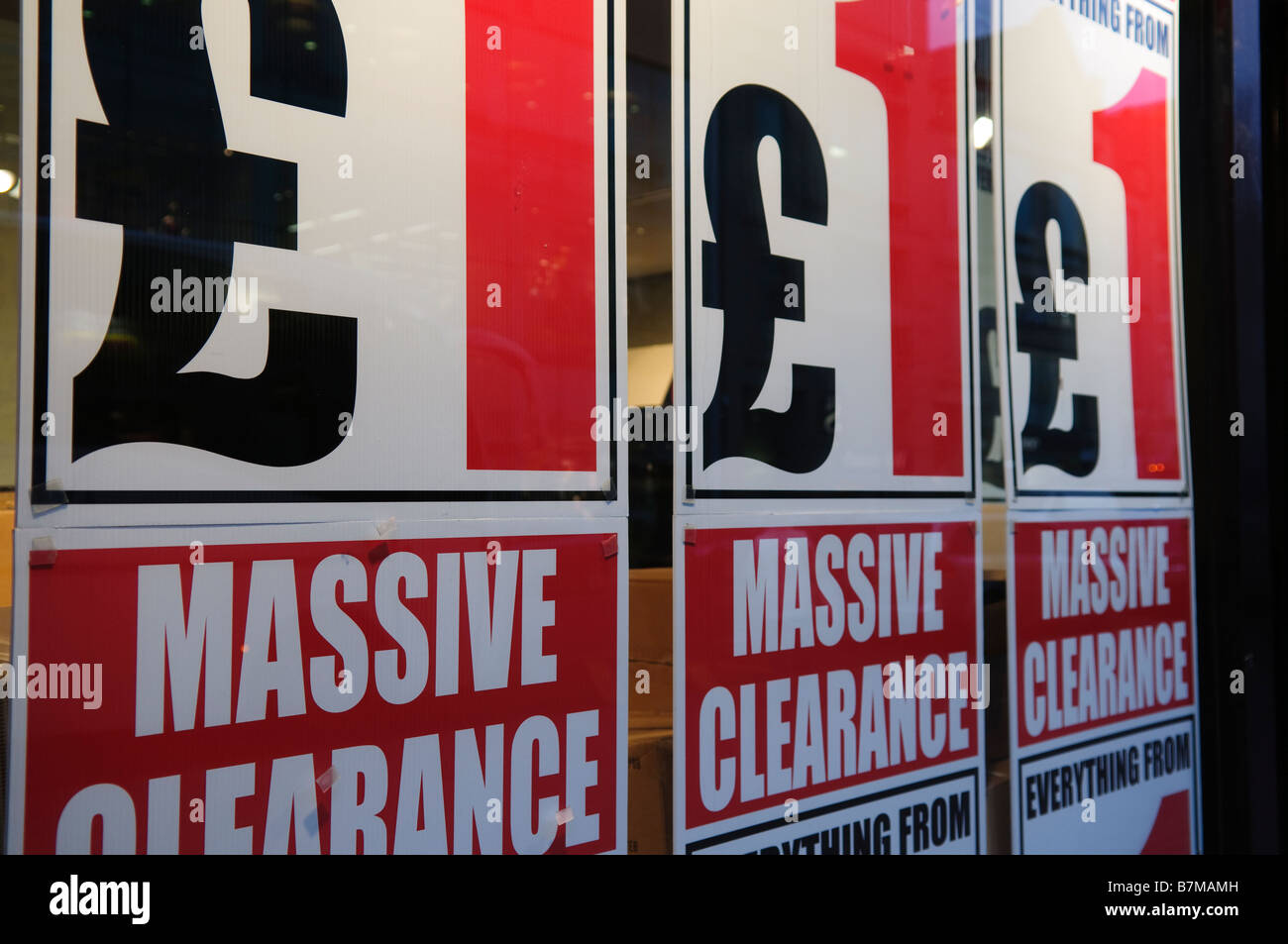 Posters in shop window stating Massive Clearance and Everything from £1 ...
