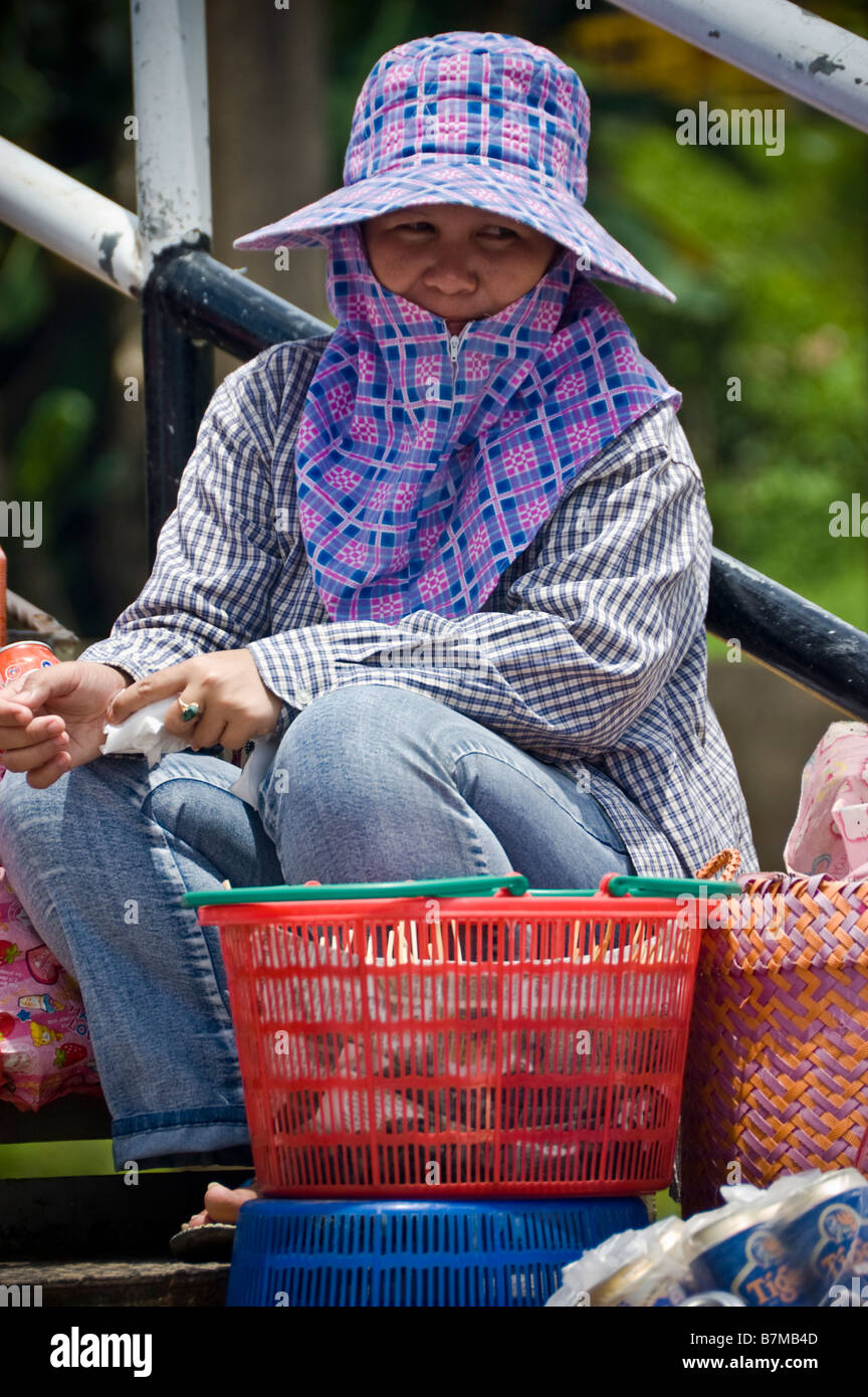 Female street vendor on the jetty in Kapit, Malaysia Stock Photo - Alamy
