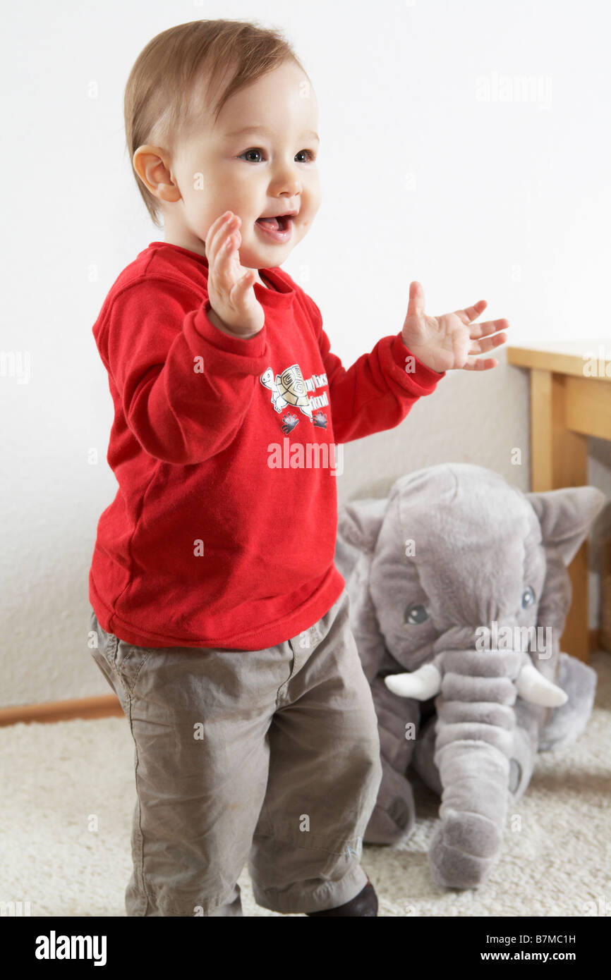 Child (12-18 months) laughing and clapping hands Stock Photo - Alamy
