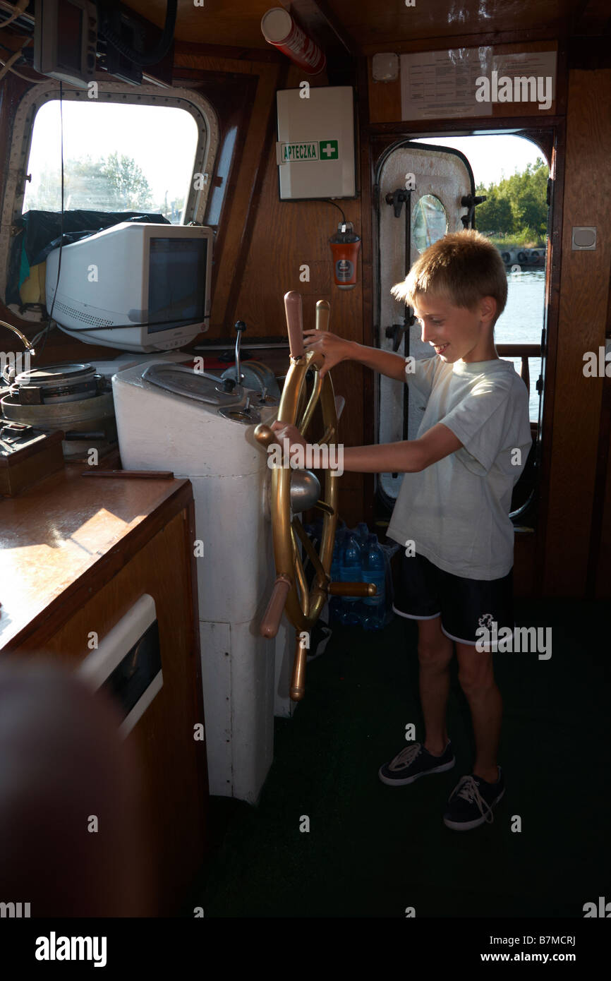 Young helmsman hi-res stock photography and images - Alamy