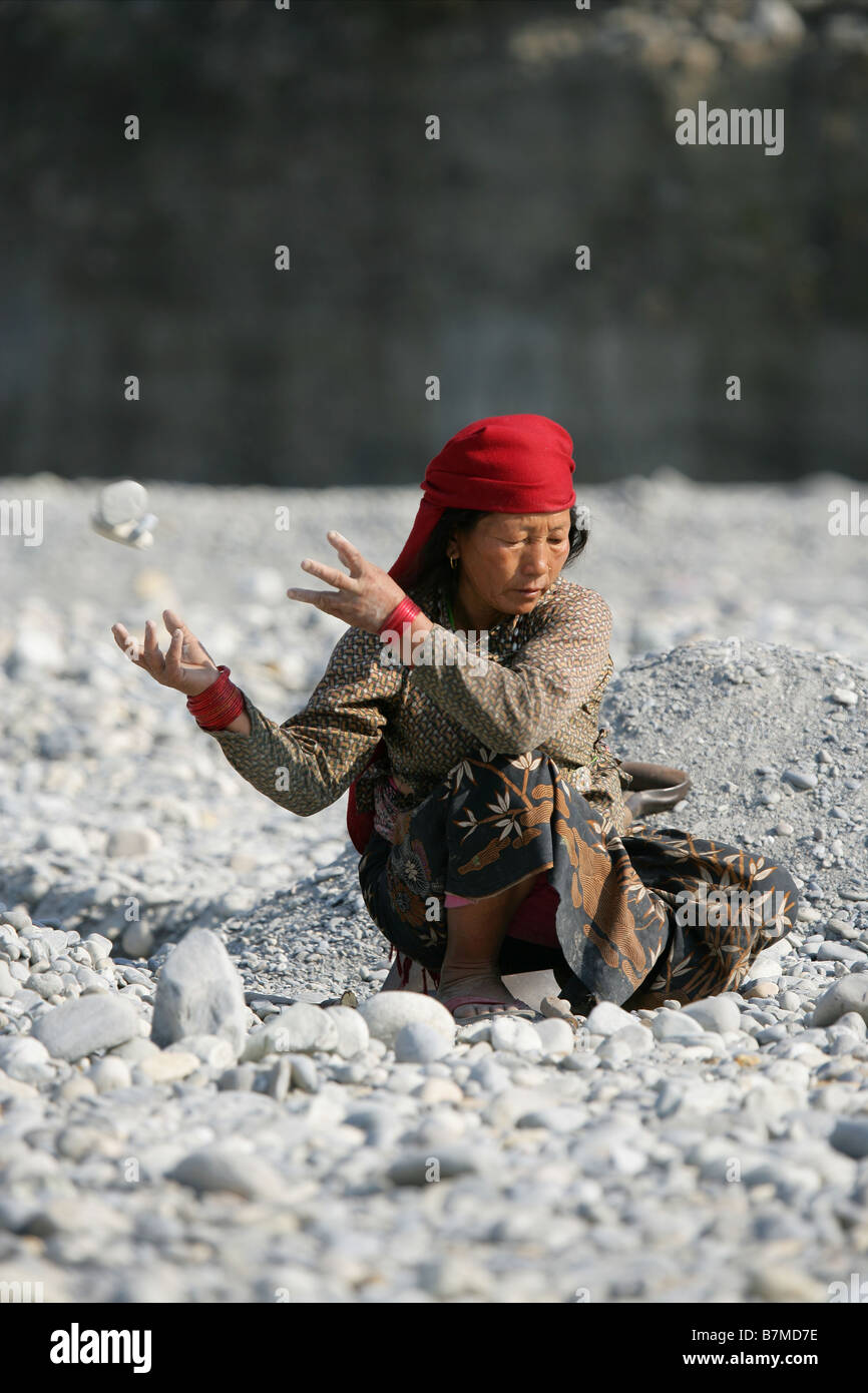 Old Lady grading stone Stock Photo - Alamy