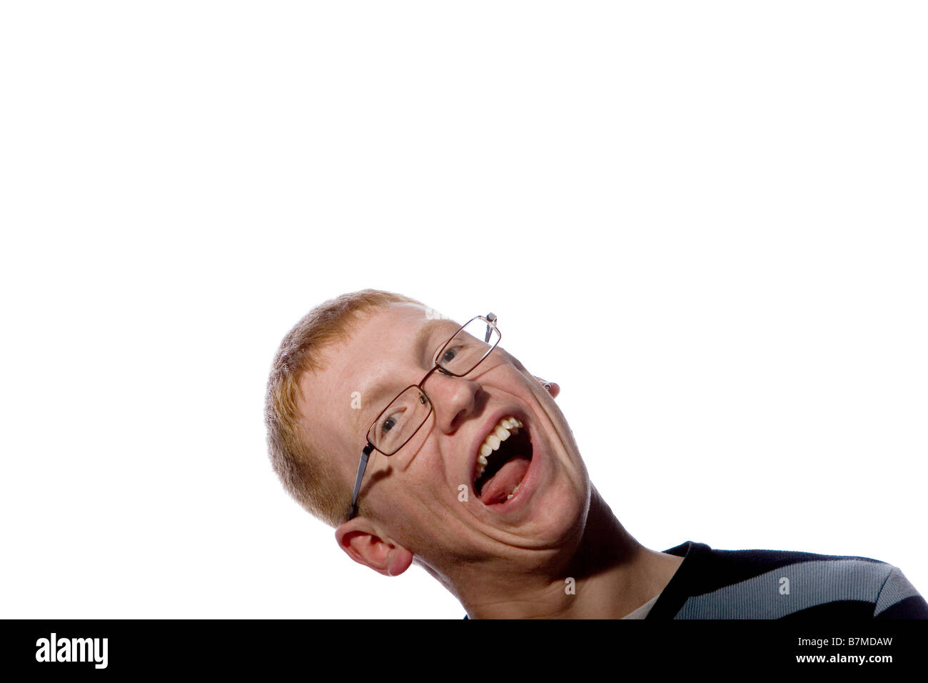 Wacky faced teenager with glasses Stock Photo - Alamy