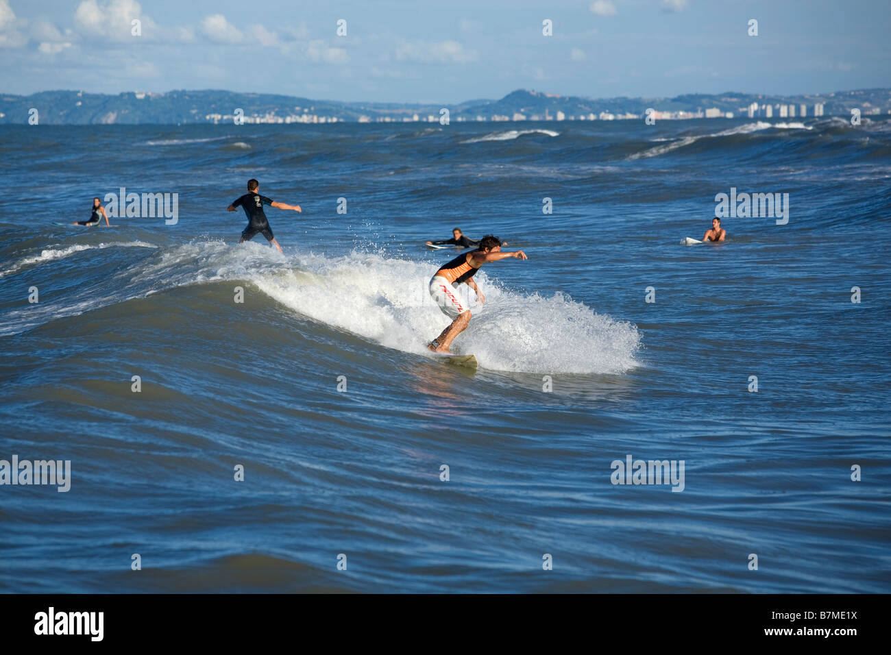 group of people surfing on waves Stock Photo - Alamy