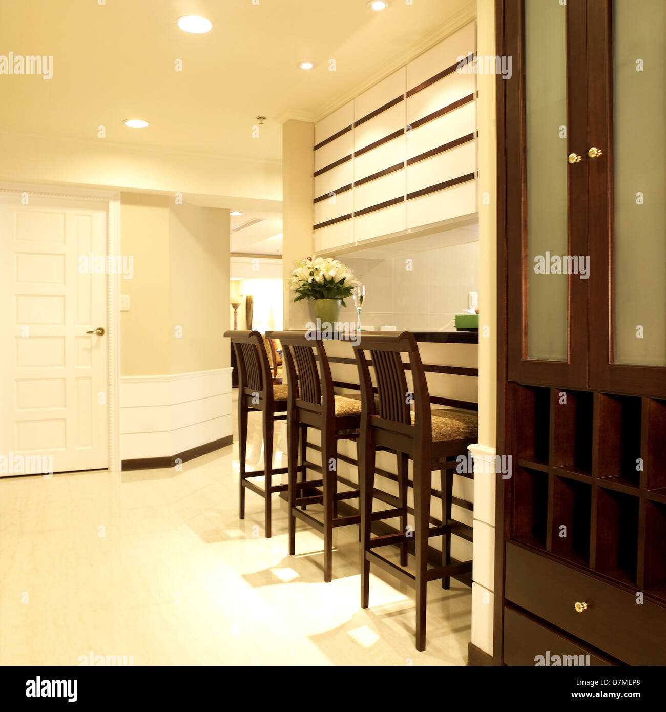 View of empty modern kitchen and dining room Stock Photo - Alamy