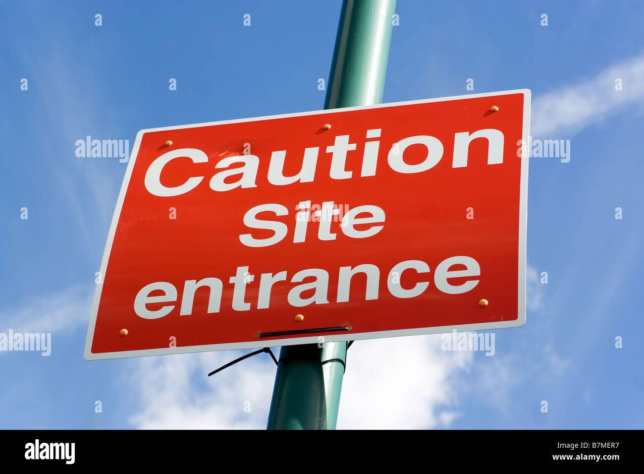 large red caution road sign for work site entrance Stock Photo - Alamy