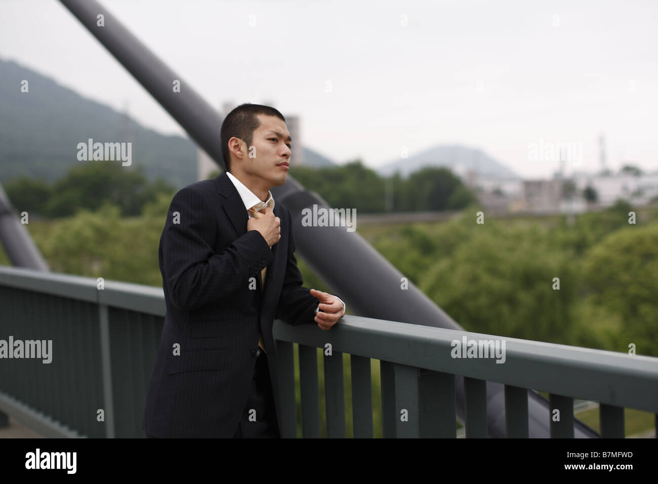 Businessman railing bridge hi-res stock photography and images - Alamy