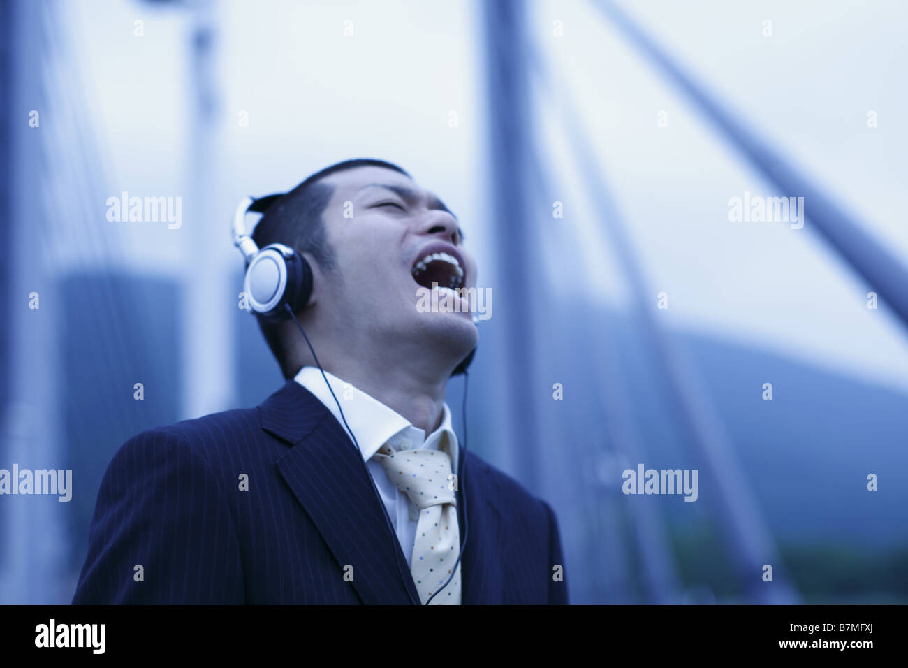Businessman listening music shouting hi-res stock photography and ...
