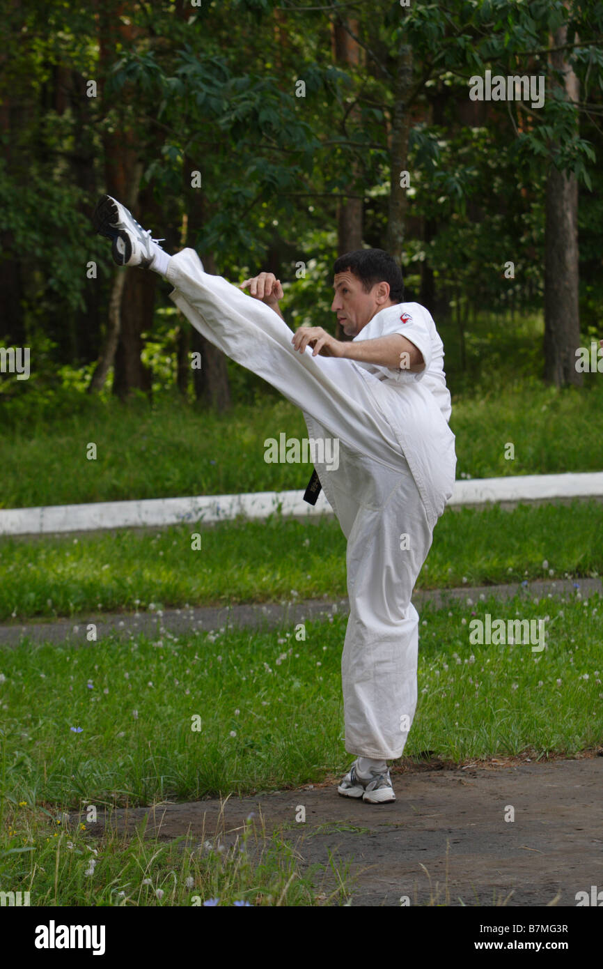 Instructor demonstrating a karate move Stock Photo - Alamy