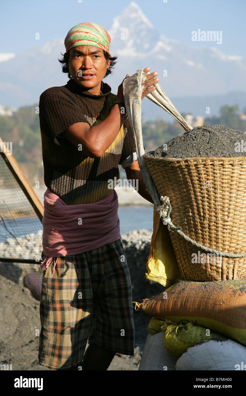 Man quarrying sand Stock Photo - Alamy