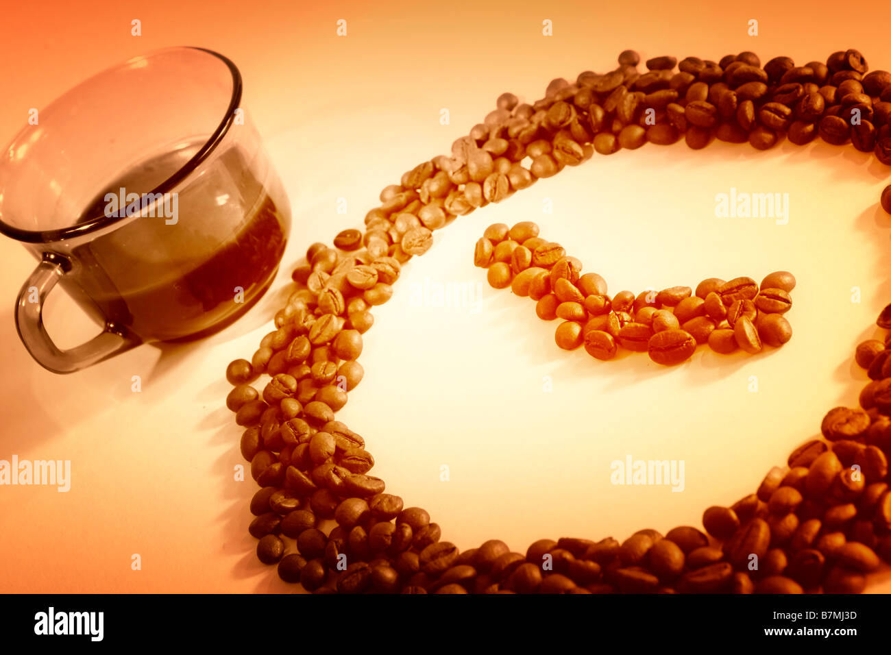 Clock made from coffee beans Stock Photo - Alamy
