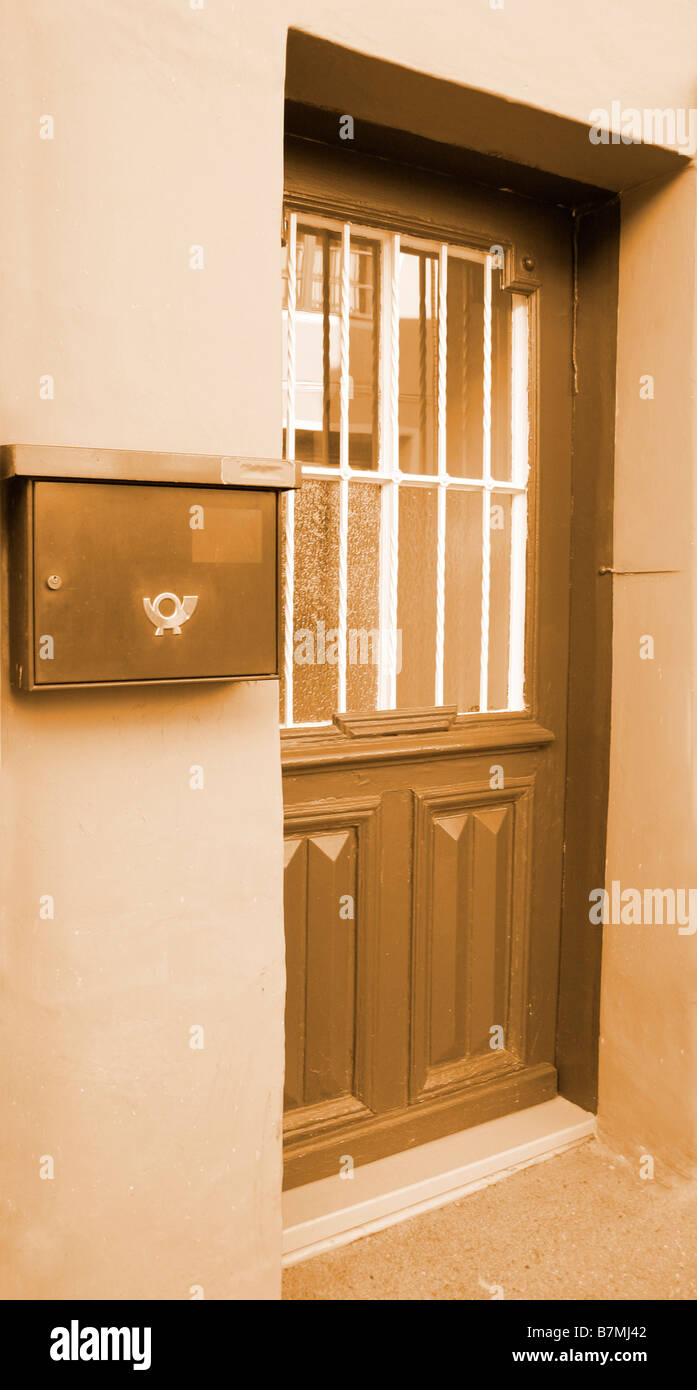 light red door with metal post Stock Photo - Alamy