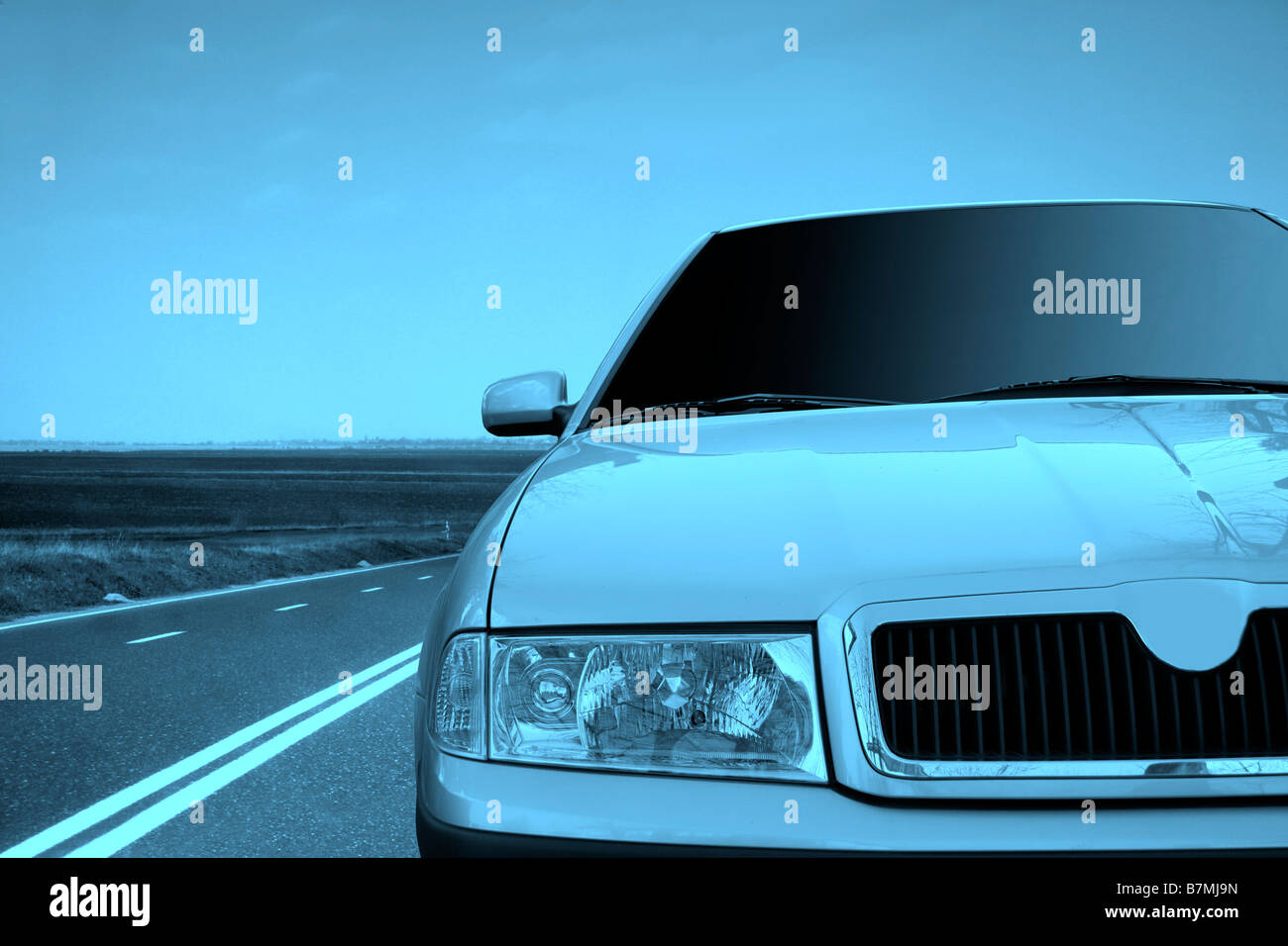 Car on the highway viewed from the front Stock Photo - Alamy