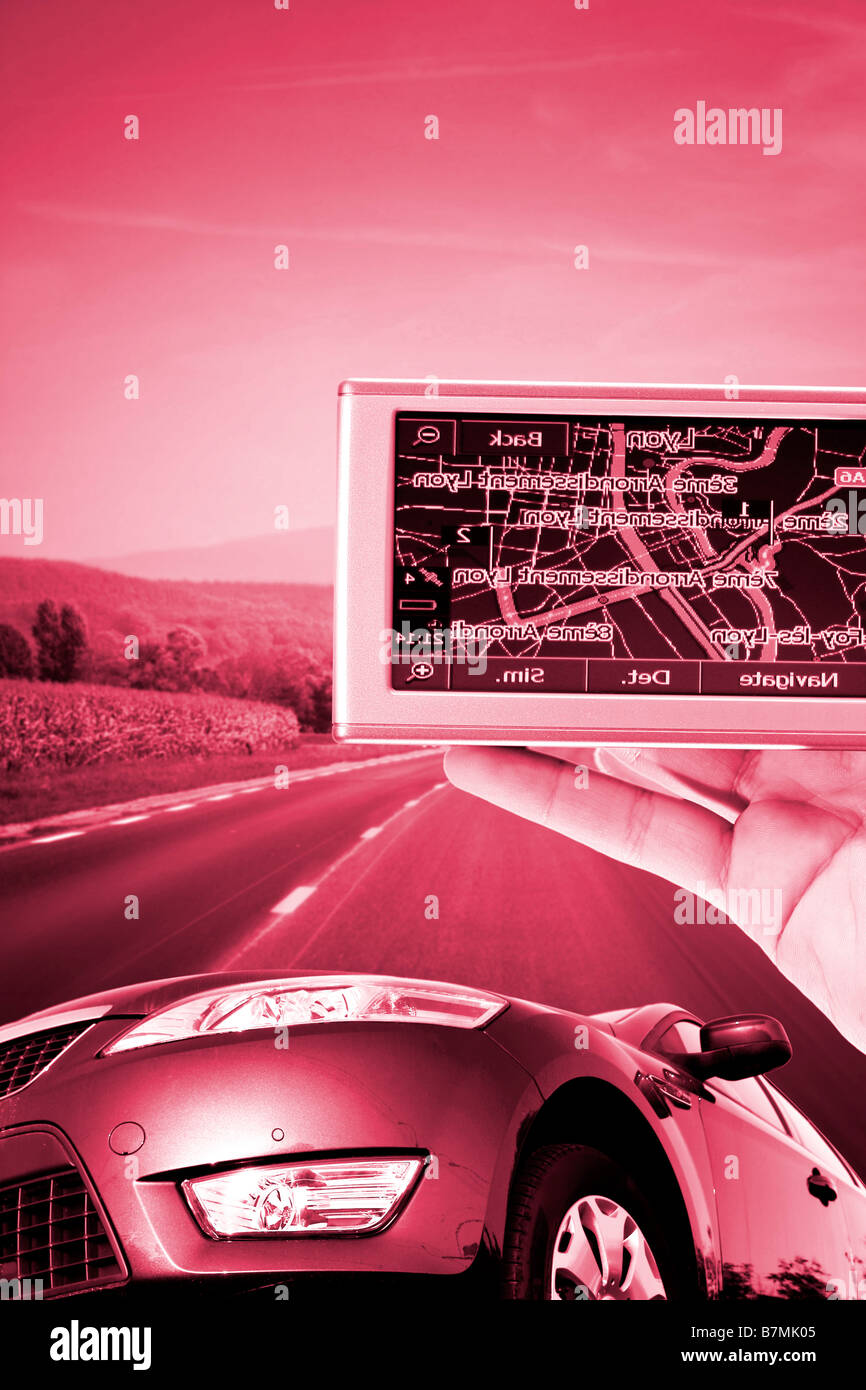 GPS Vehicle navigation system in a man hand Stock Photo - Alamy