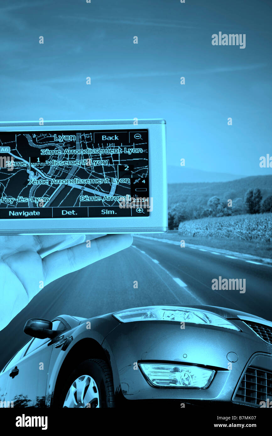 GPS Vehicle navigation system in a man hand Stock Photo - Alamy
