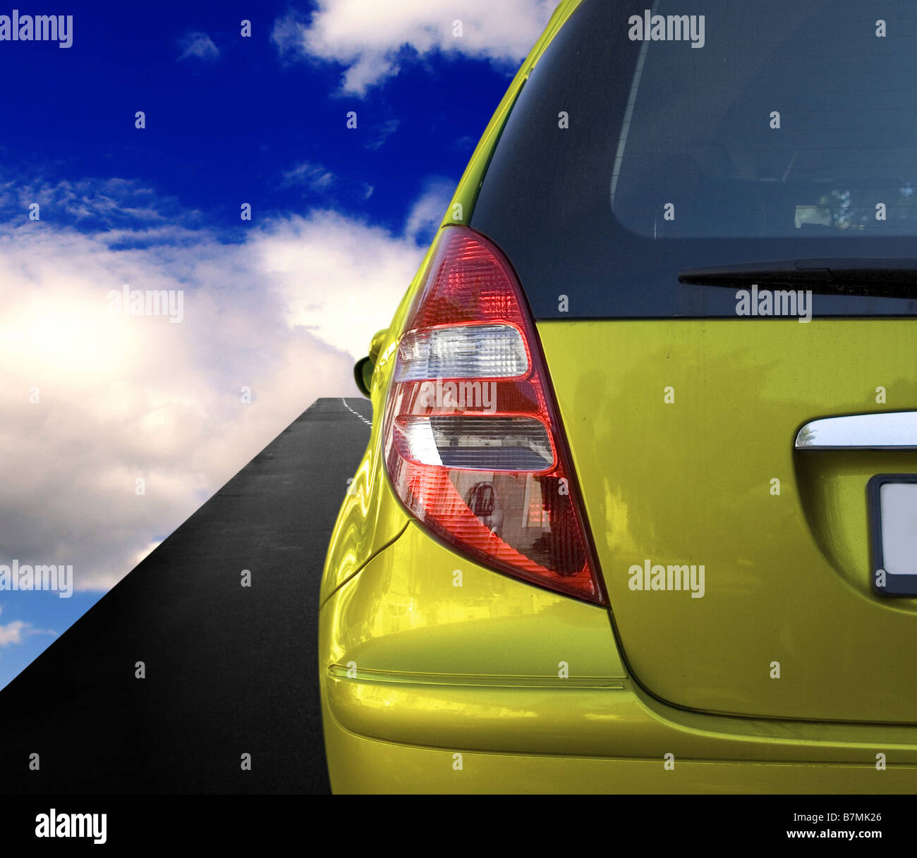 Yellow car on the road Stock Photo - Alamy