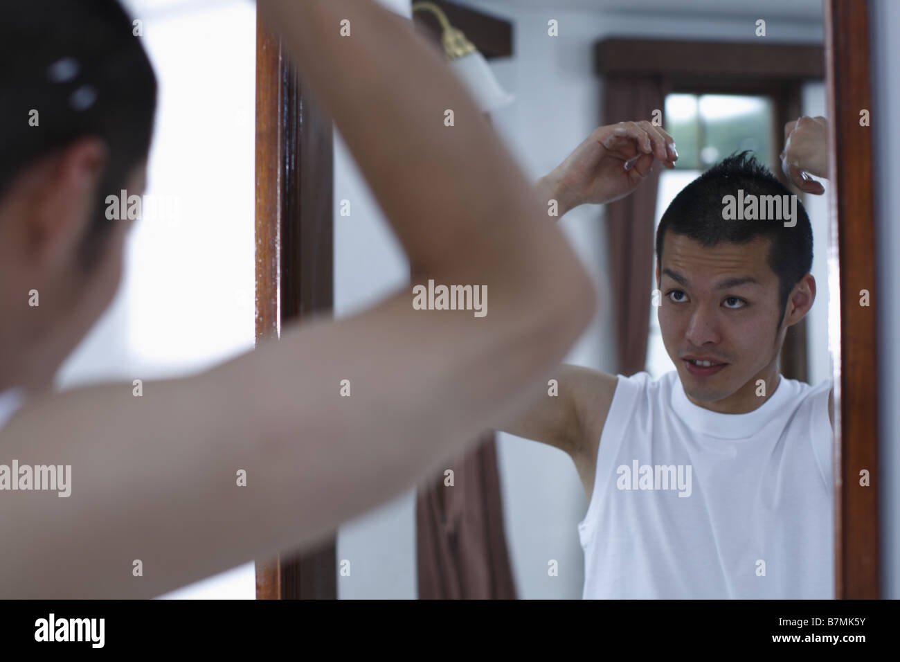 Man Having His Hair Set in Bathroom Stock Photo - Alamy