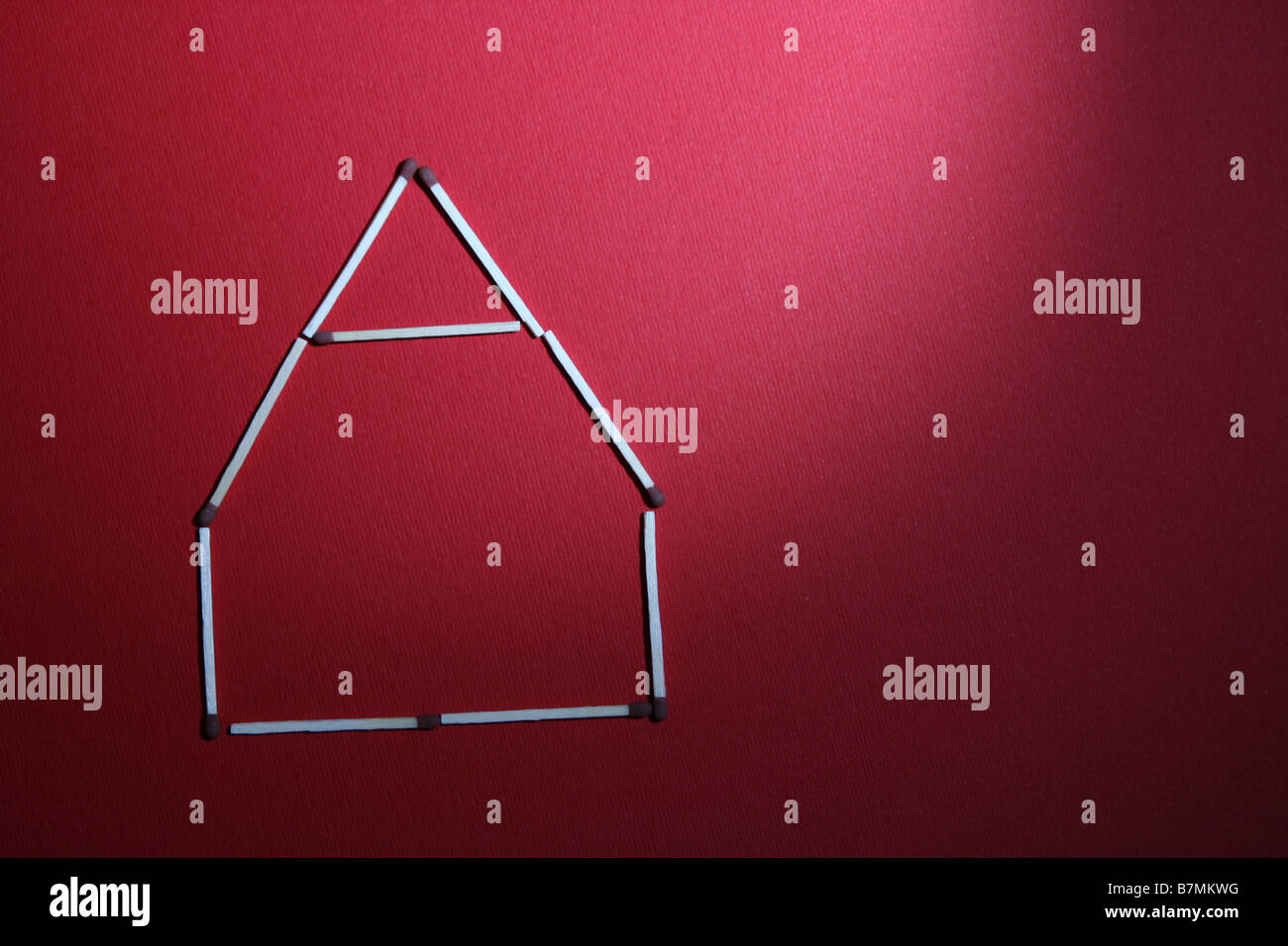 house made of matches isolated on red backround Stock Photo - Alamy