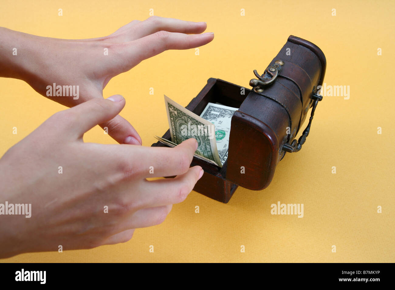 Wood cashbox isolated on yellow Stock Photo - Alamy