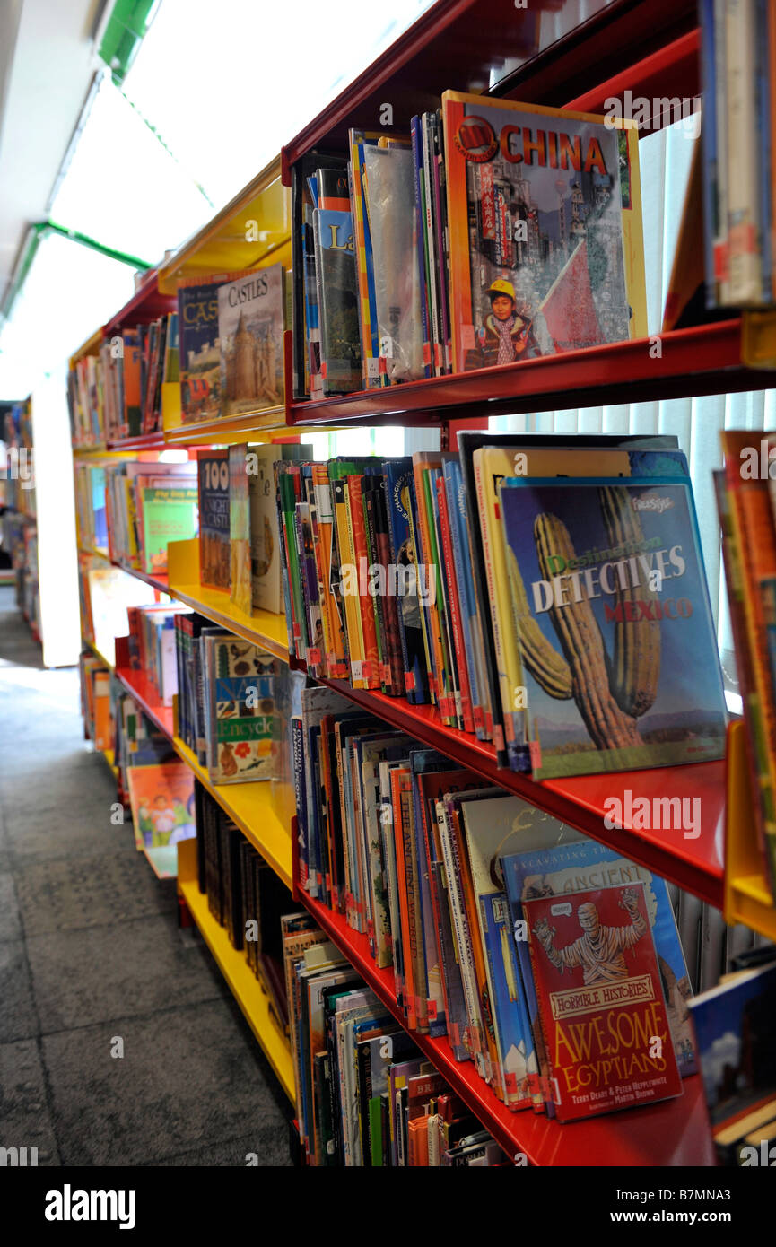 Books on a library shelf Stock Photo - Alamy